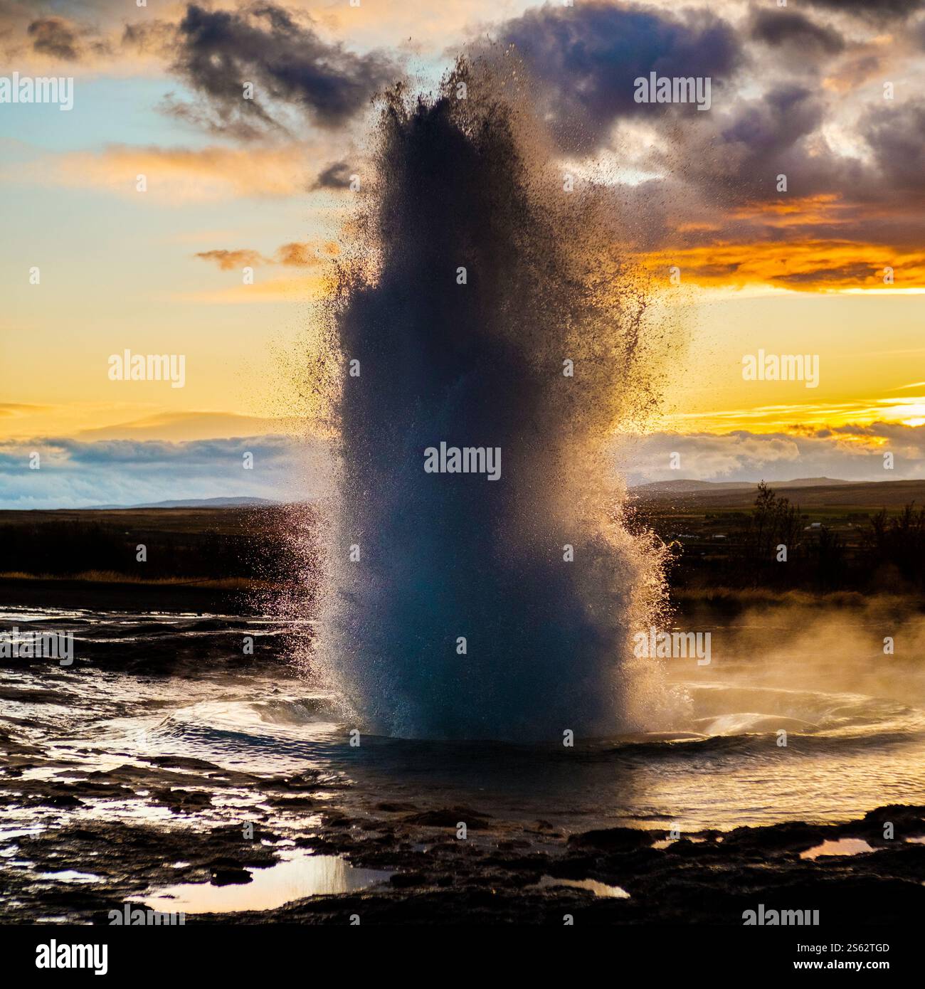 Powerful eruption of Strokkur geysir at sunset in south Iceland ...