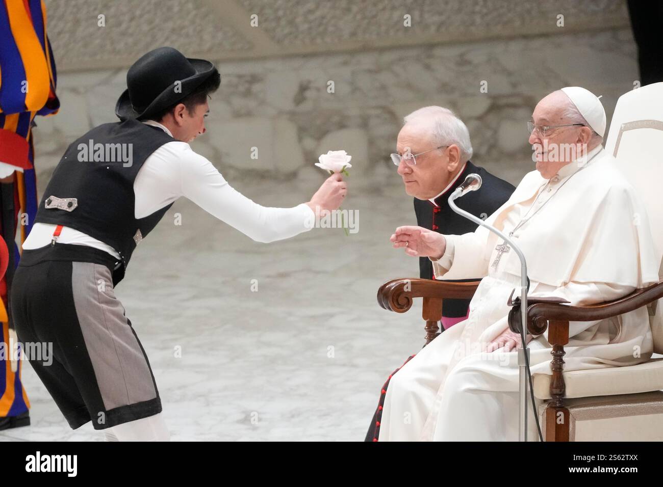 Pope Francis enjoys a joke by a circus artist during the weekly general ...