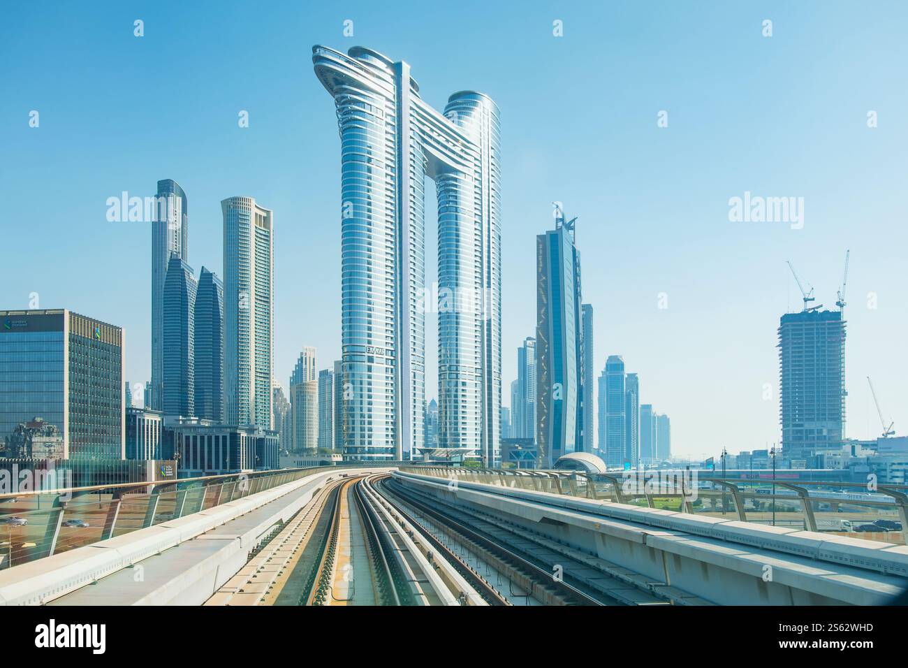 Dubai, UAE - May 5, 2024: Futuristic skyline with modern metro track ...