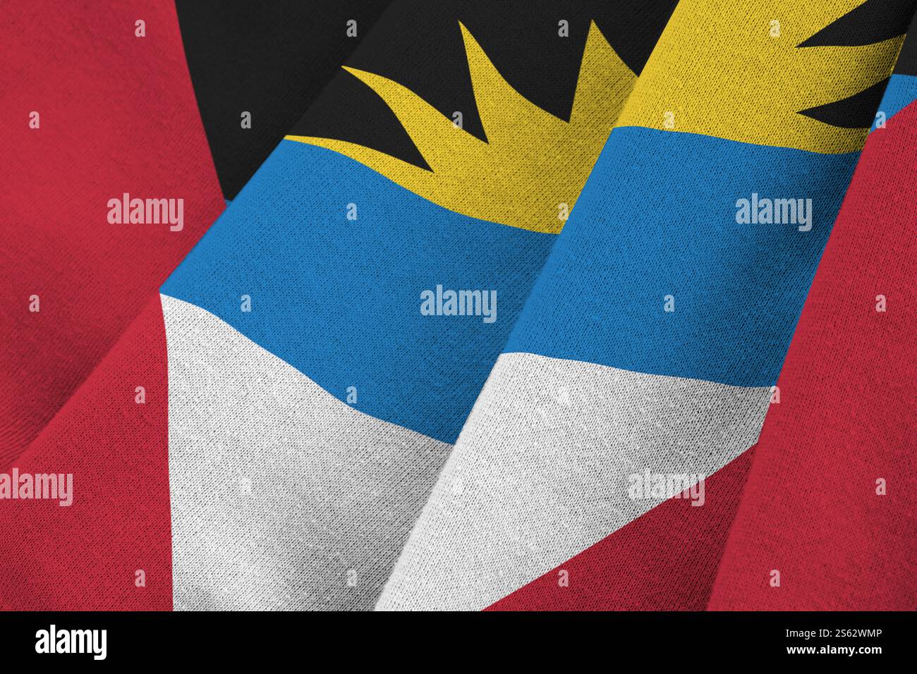 Antigua and Barbuda flag with big folds waving close up under the ...