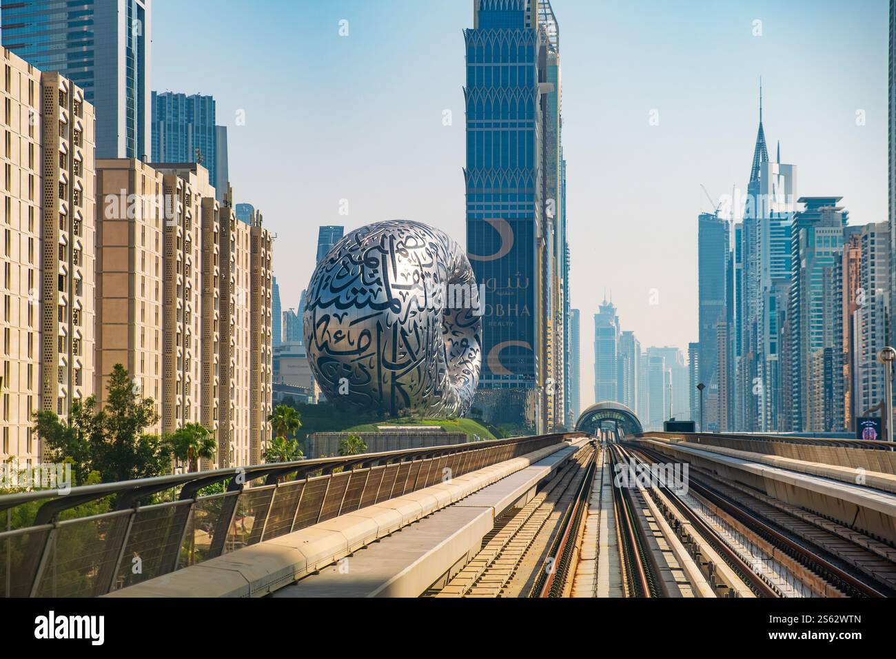 Dubai, UAE - May 5, 2024: Futuristic skyline with modern metro track ...