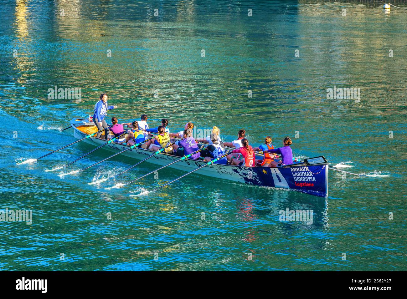 A Basque Trainera with coordinated rowers glides during a training ...