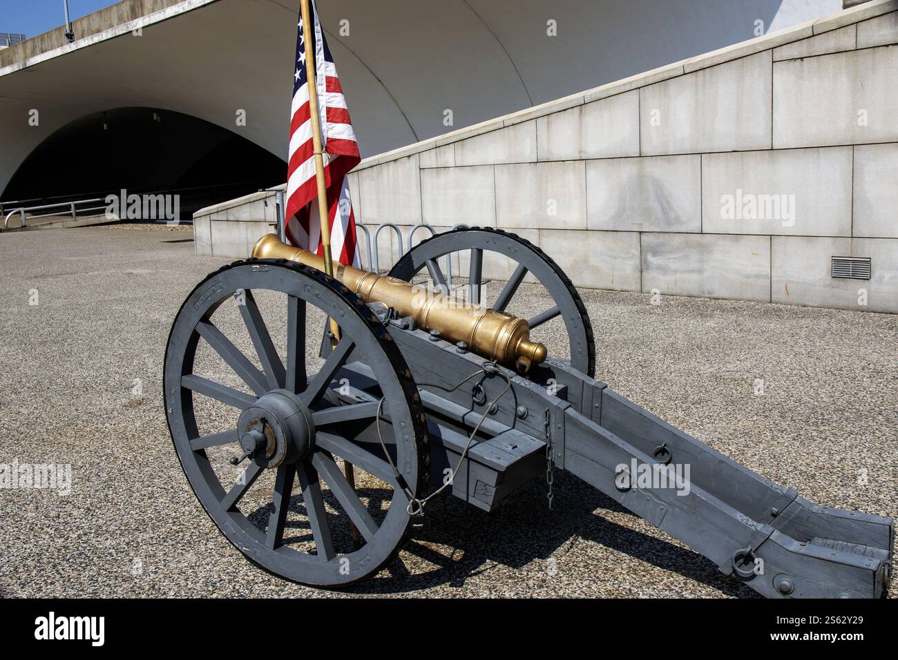 A historical cannon with a golden barrel is displayed prominently along ...