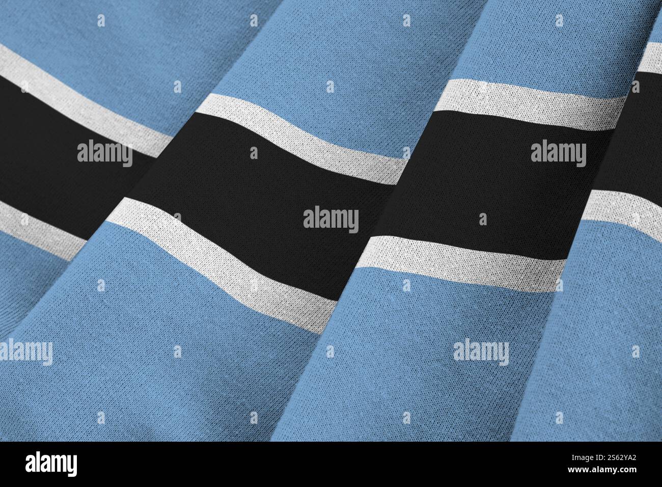 Botswana flag with big folds waving close up under the studio light ...