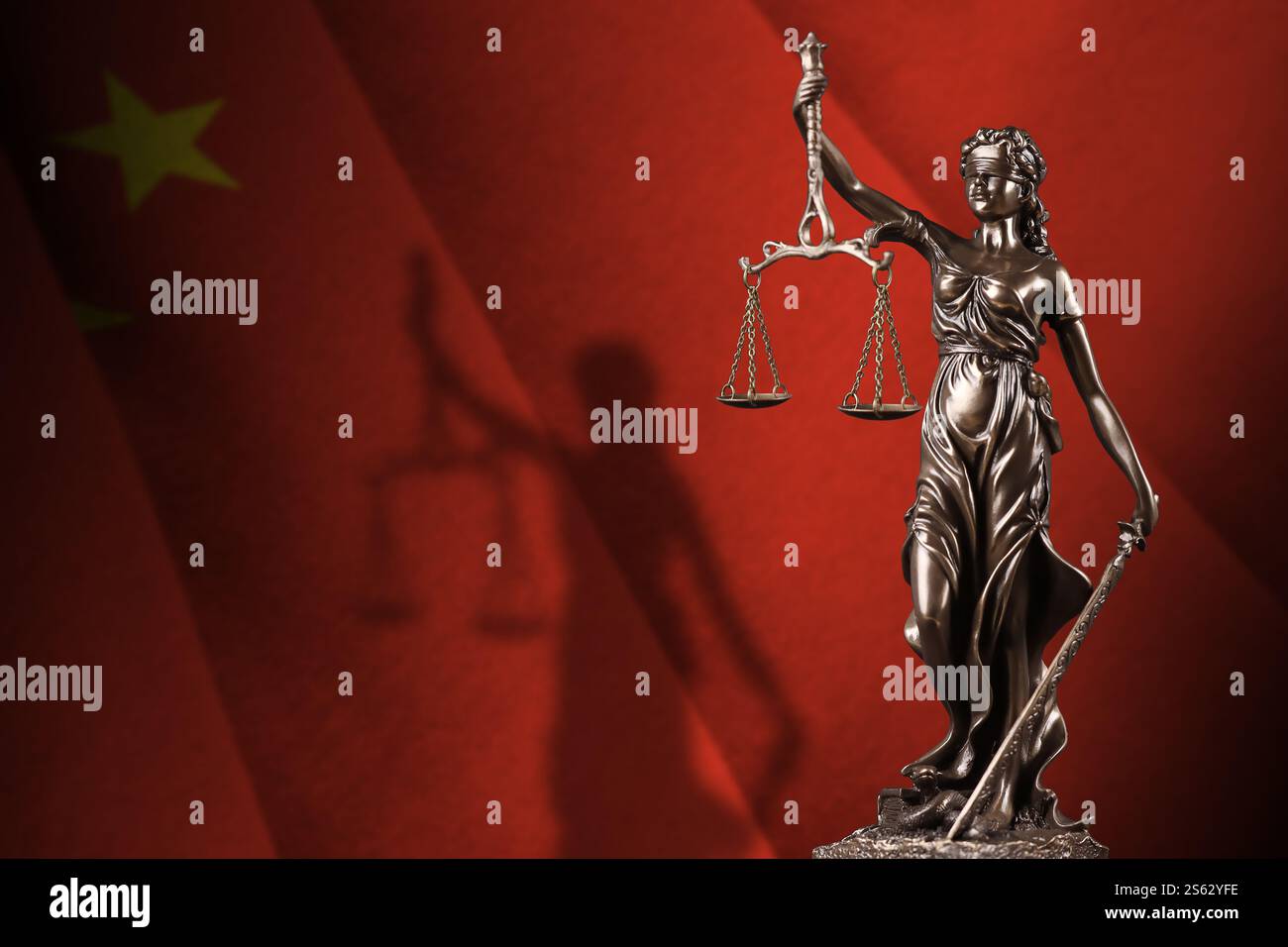 China flag with statue of lady justice and judicial scales in dark room ...