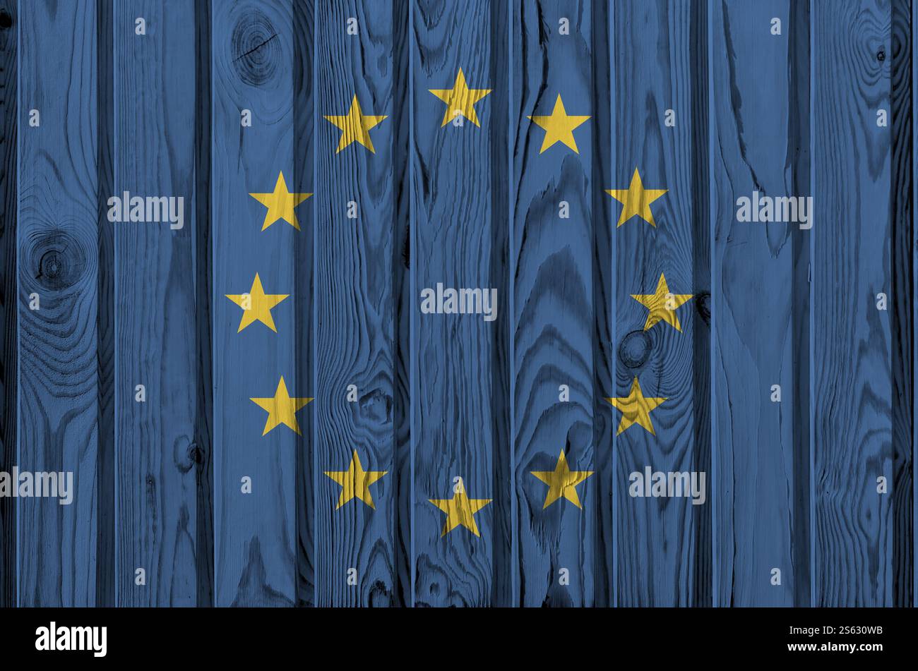 European union flag depicted in bright paint colors on old wooden wall ...