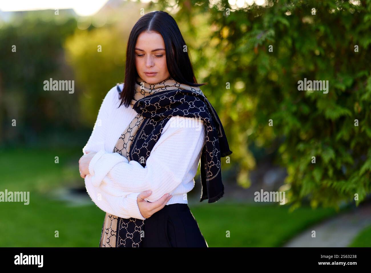 Woman walking outdoors thinking Stock Photo - Alamy