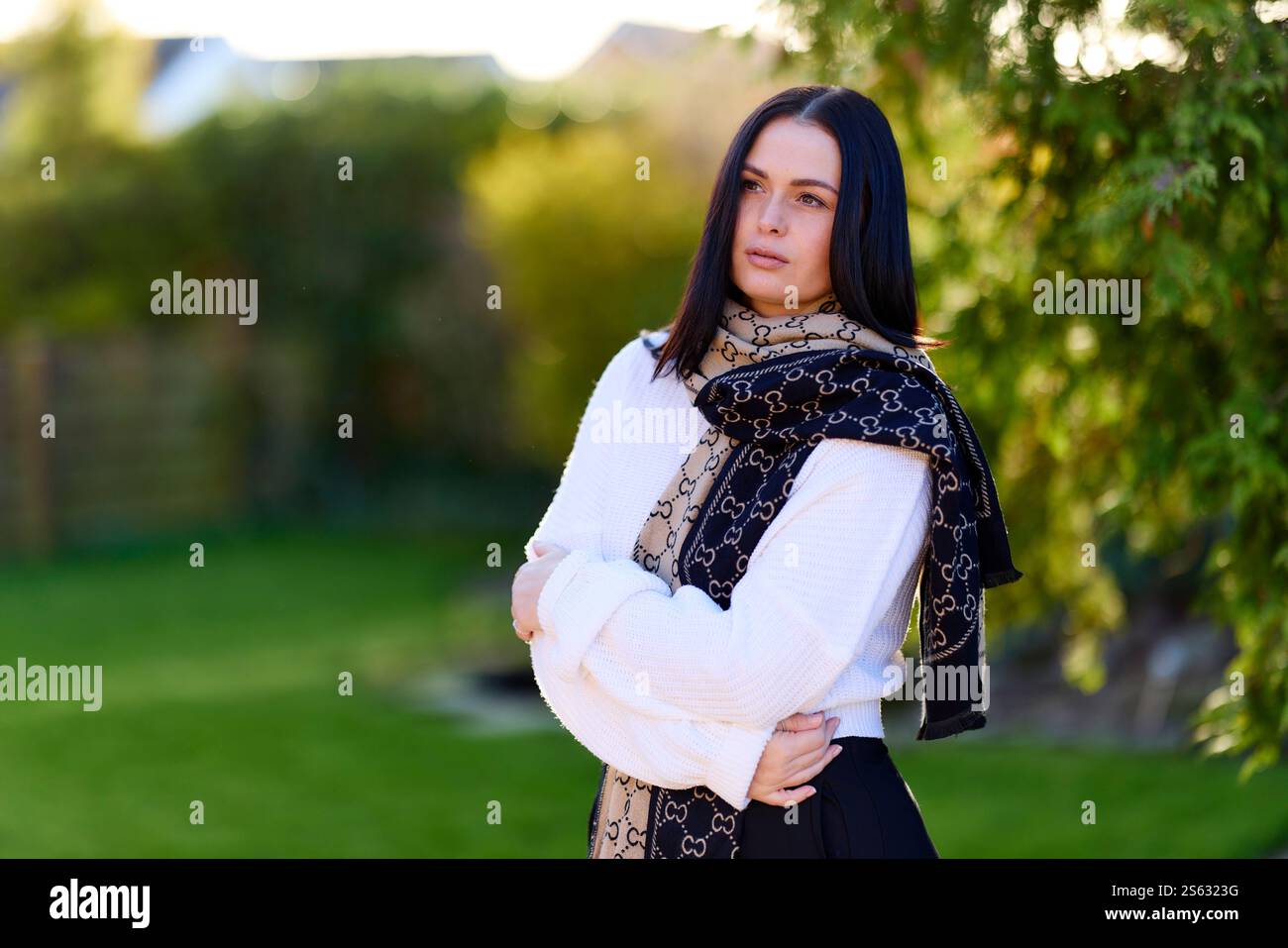 Woman walking outdoors thinking Stock Photo - Alamy