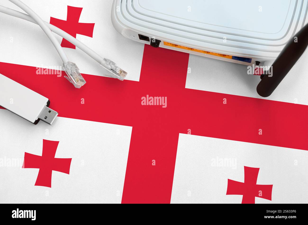 Georgia flag depicted on table with internet rj45 cable, wireless usb ...