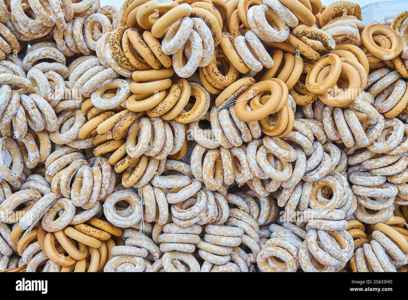 Fresh crispy pretzels or bagels displayed for sale at a street food ...