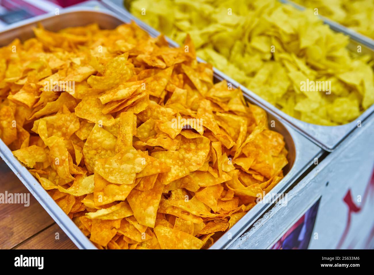 Hand cut triangular potato chips at the county fair Stock Photo - Alamy