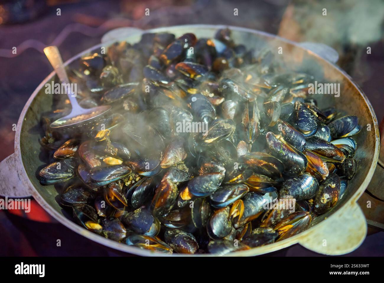 Street food. Boiled mussels with herbs at a street fair Stock Photo - Alamy