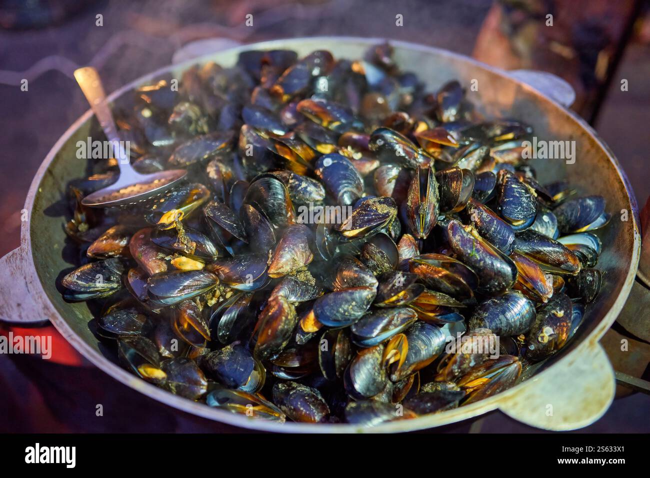 Street food. Boiled mussels with herbs at a street fair Stock Photo - Alamy