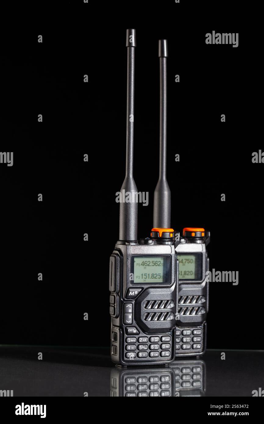 Walkietalkie set - Two-way radios on the black background Stock Photo ...