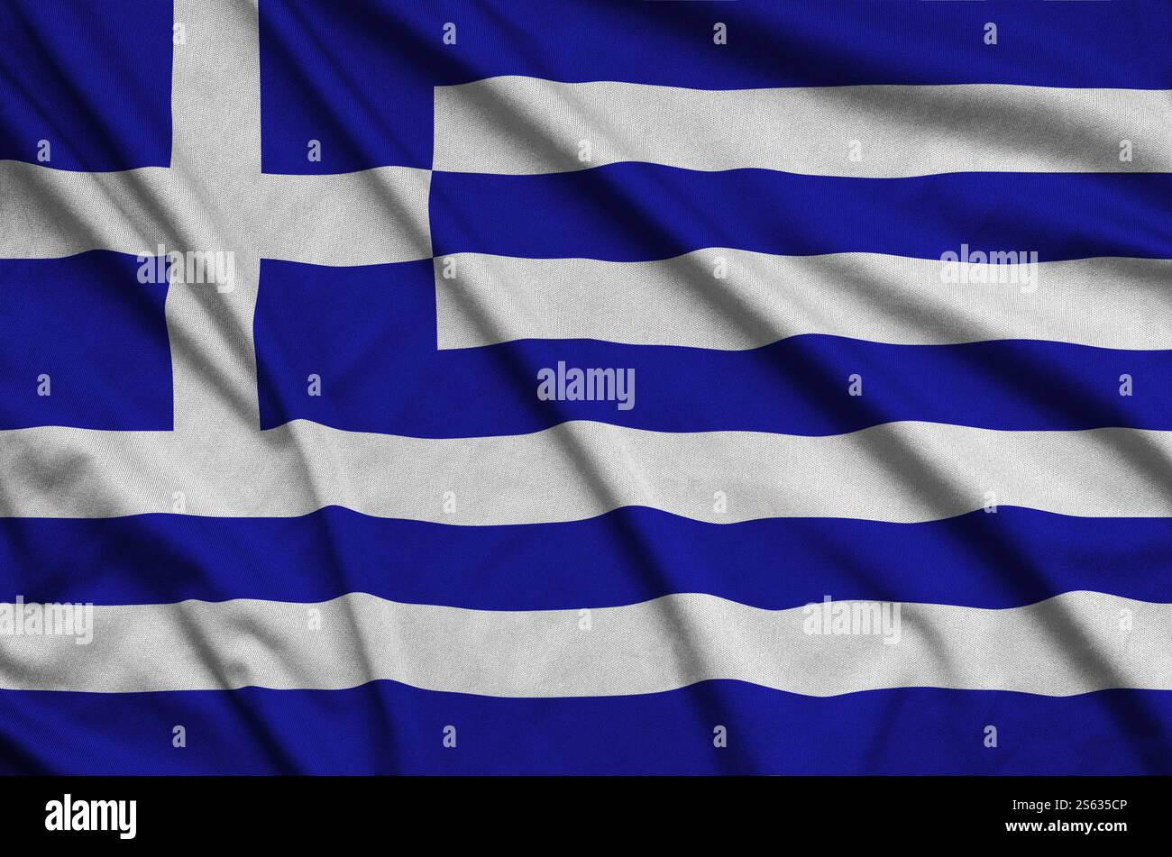 Greece flag is depicted on a sports cloth fabric with many folds. Sport ...