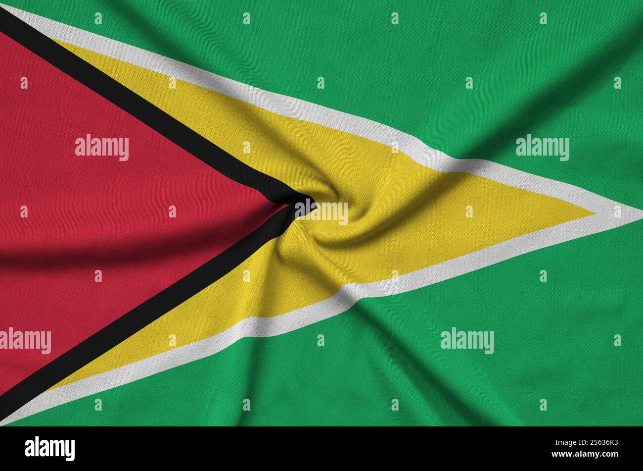 Guyana flag is depicted on a sports cloth fabric with many folds. Sport team waving banner Stock ...