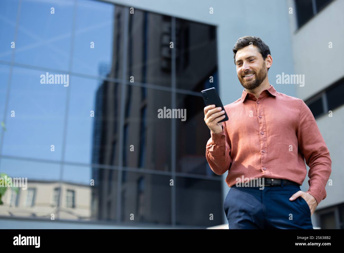 Successful man using an app on his smartphone, businessman walking ...