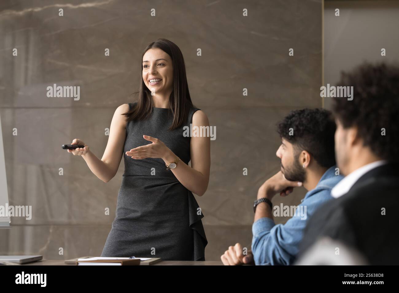 Attractive European woman coach hold seminar for staff members Stock ...