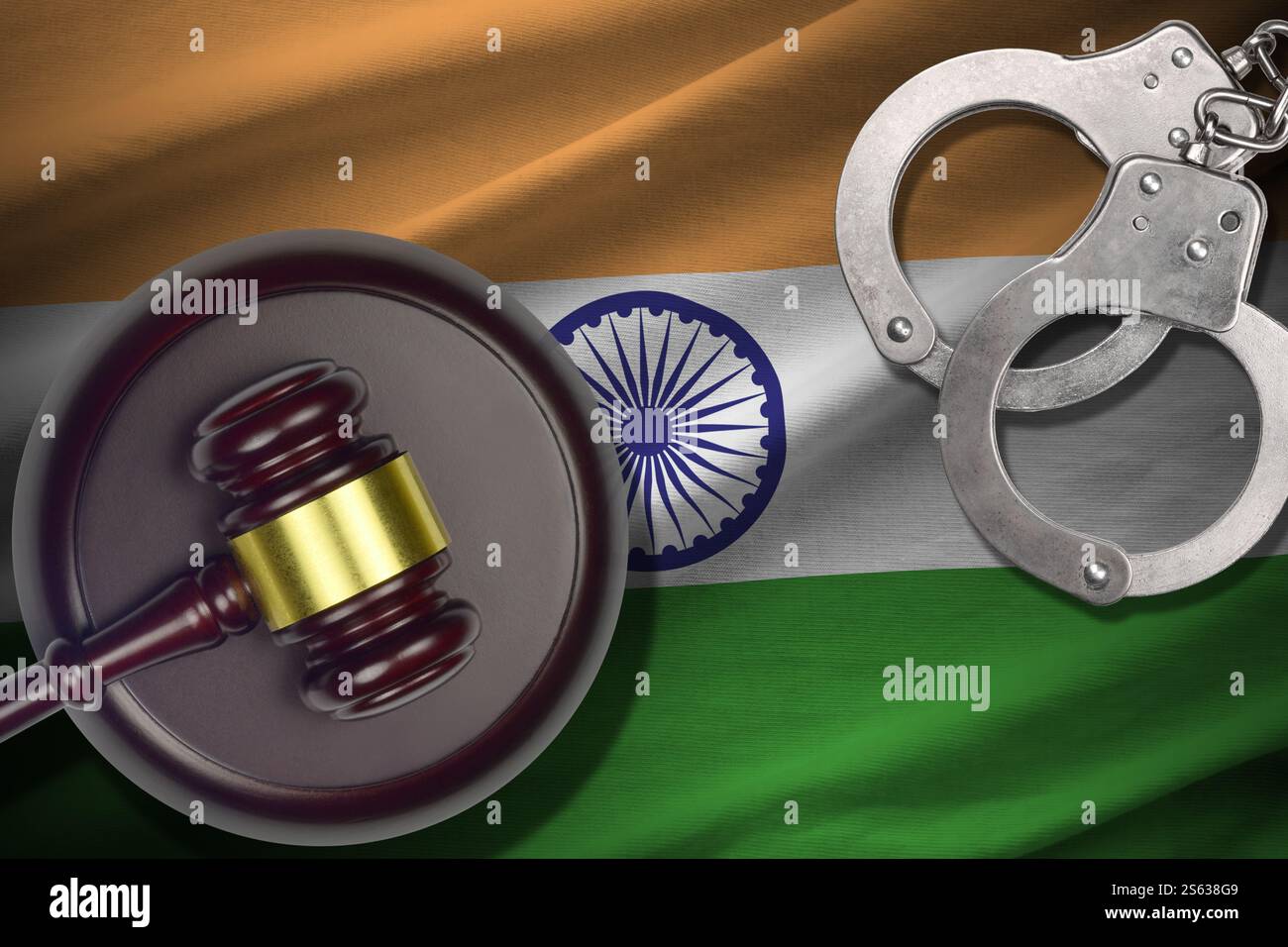 India flag with judge mallet and handcuffs in dark room. Concept of ...