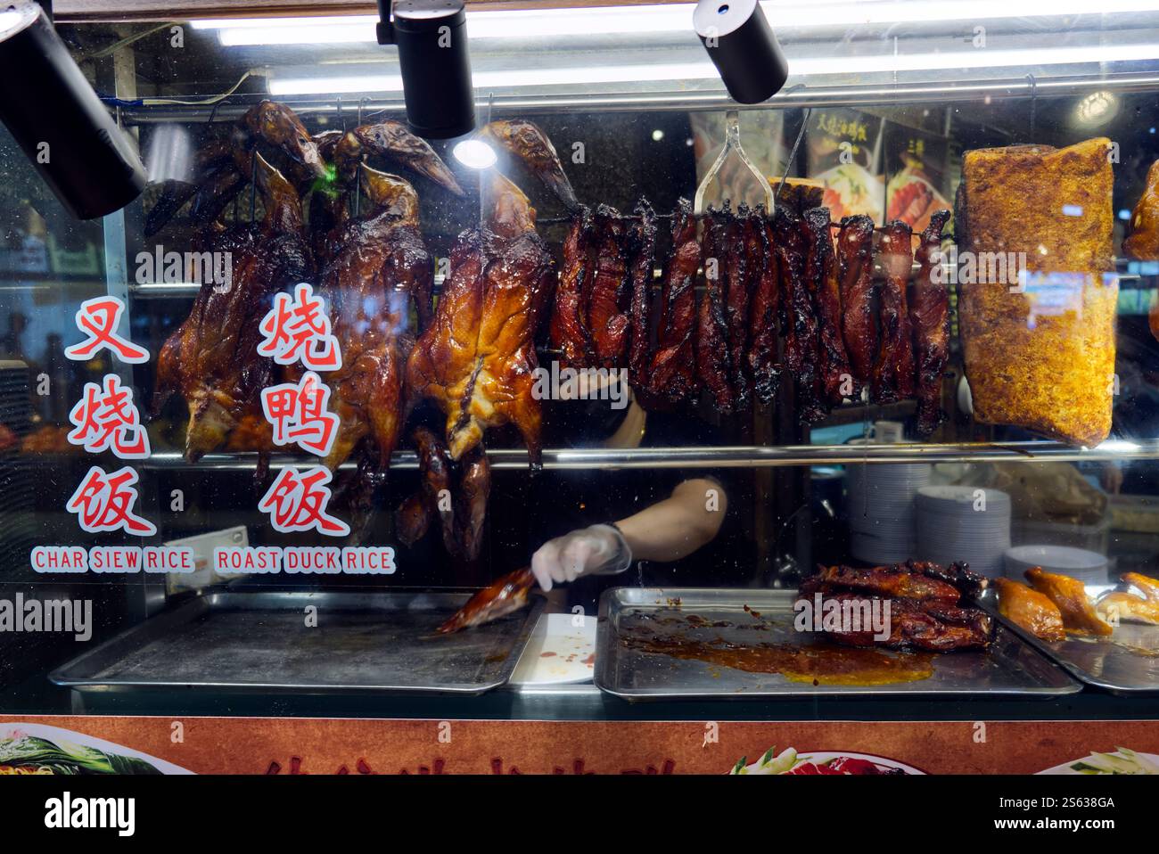 Roasted ducks with dark glossy skin, arranged on display Stock Photo ...