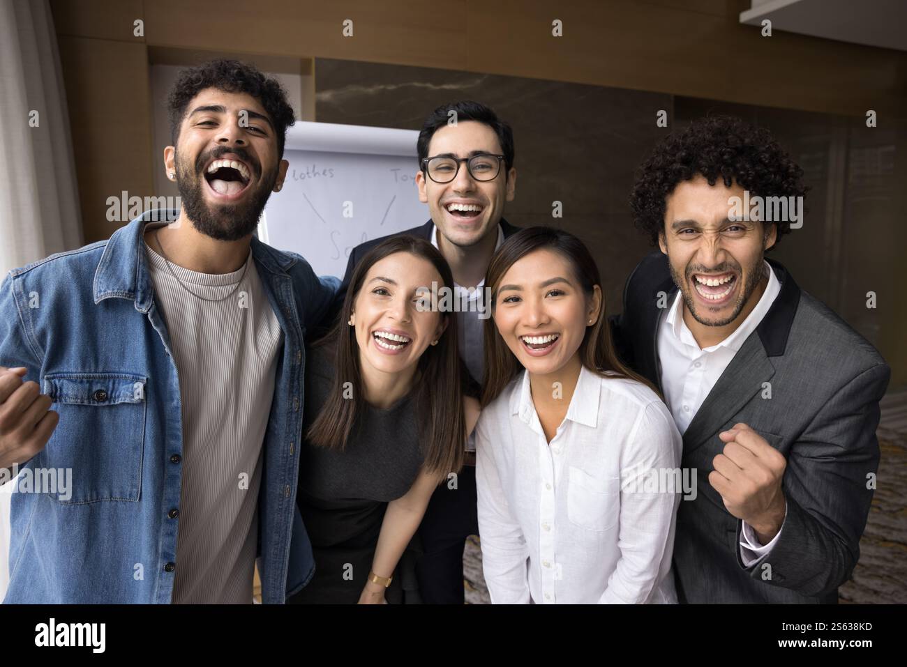 Group of five happy multiracial staff members celebrate business ...