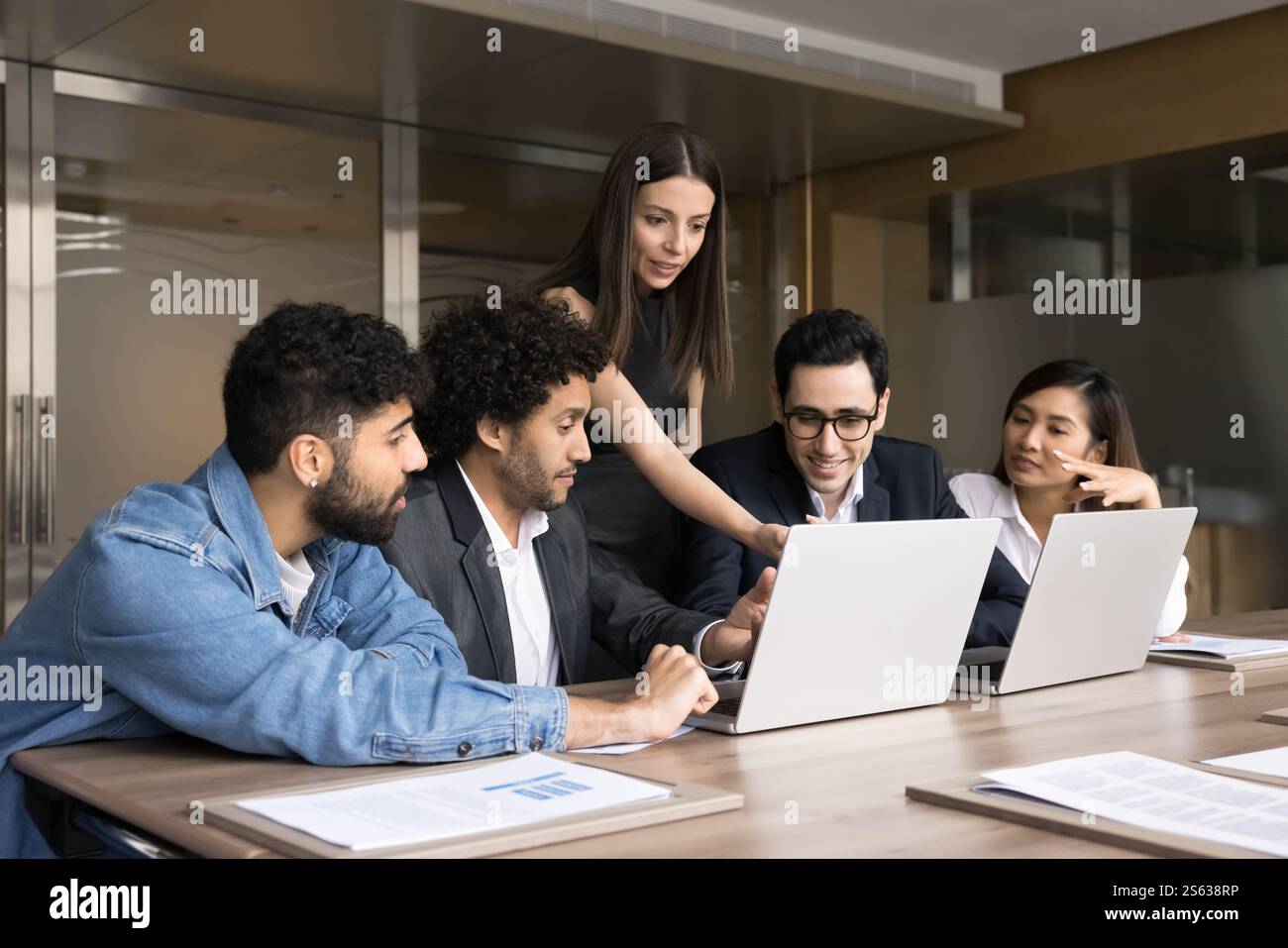 Female team leader explaining tasks, brainstorming, working together ...