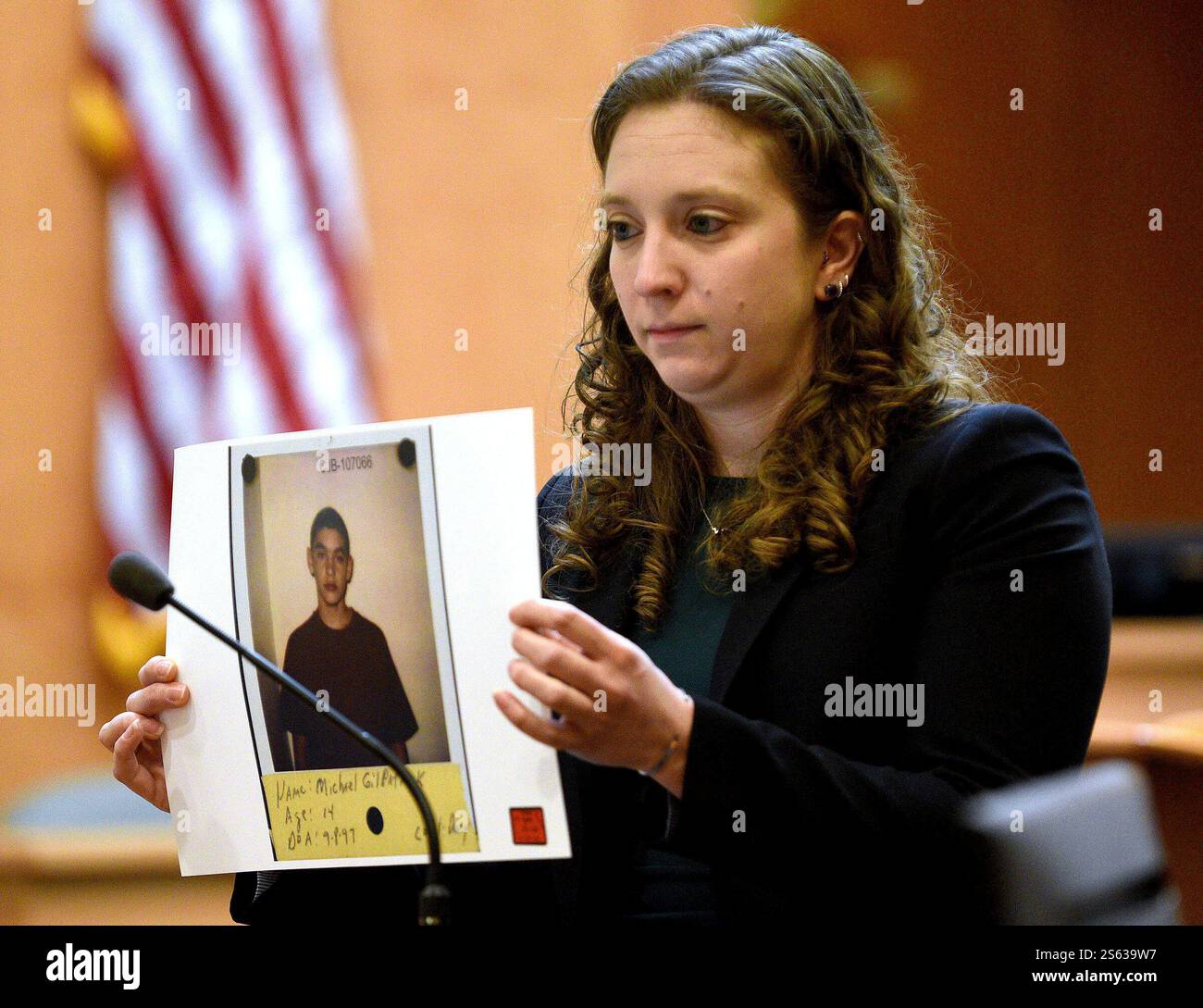 Assistant Attorney General Audriana Mekula shows the jury Michael ...