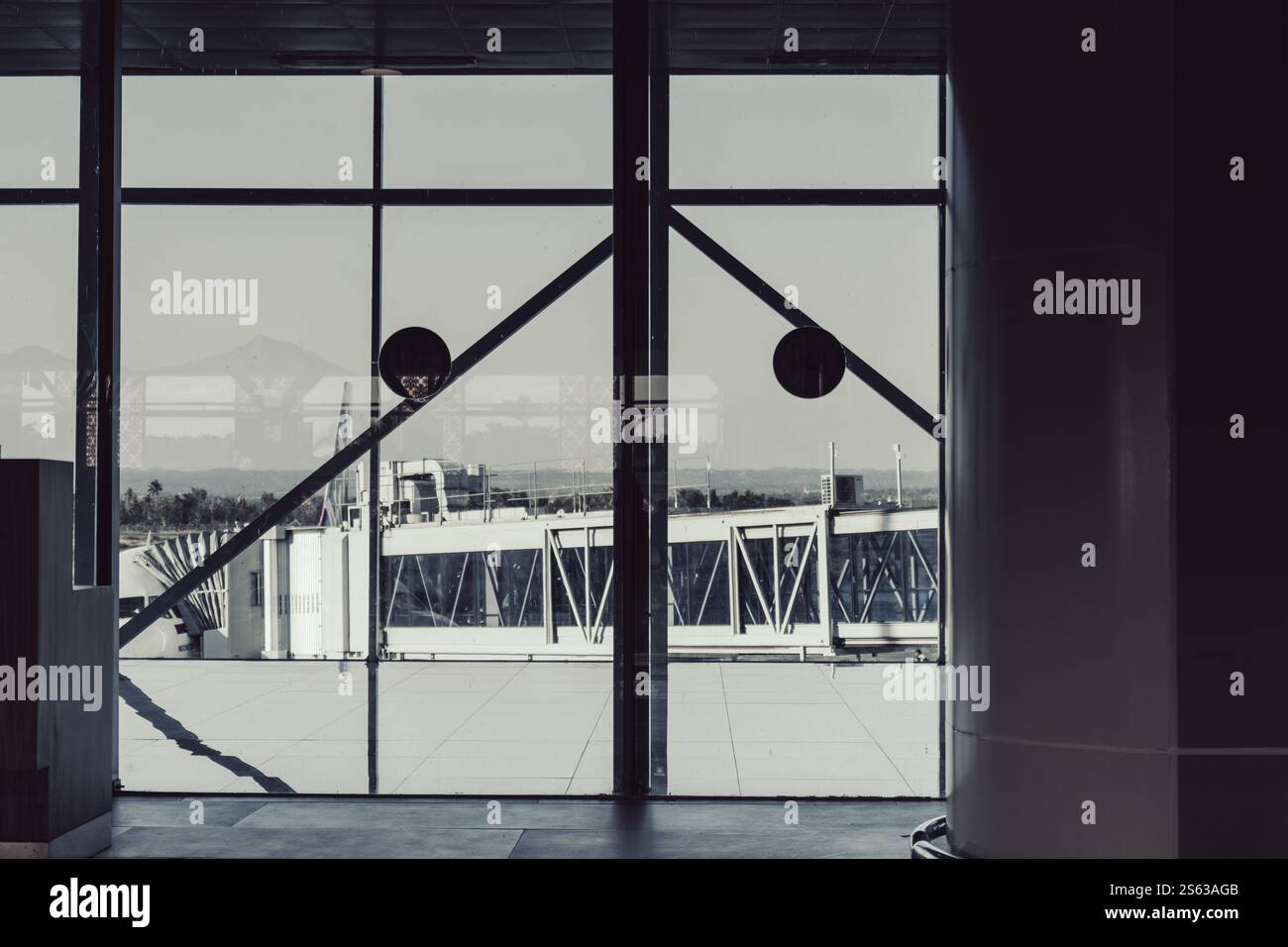 Airport terminal. window glass with the view of runaway and airplane ...