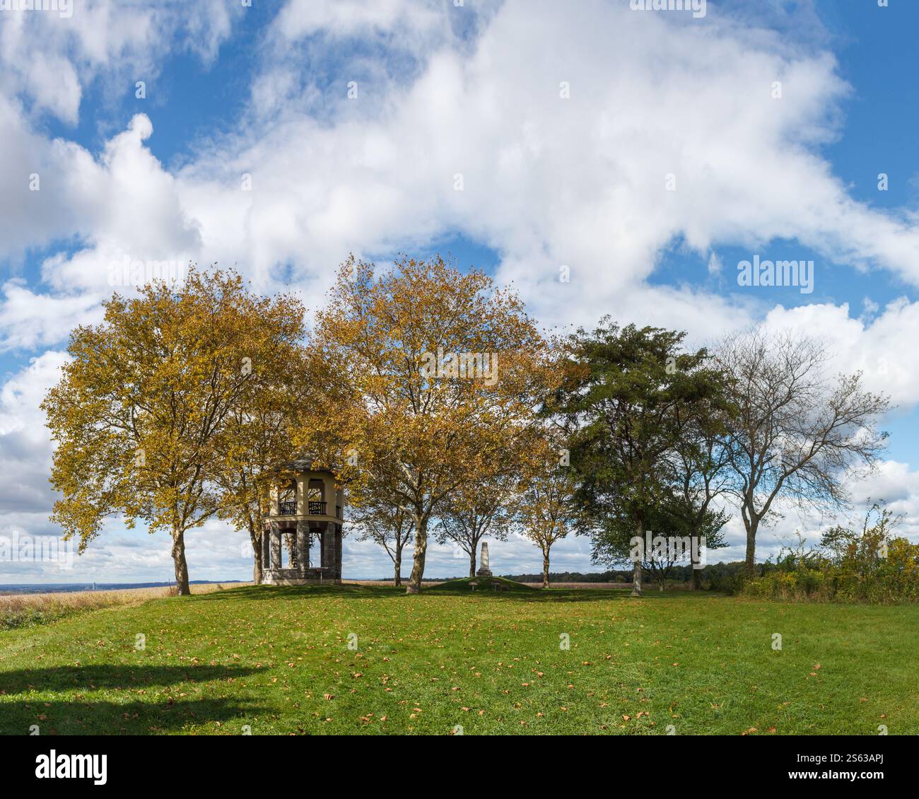 A vibrant photograph capturing a serene autumn landscape featuring a ...