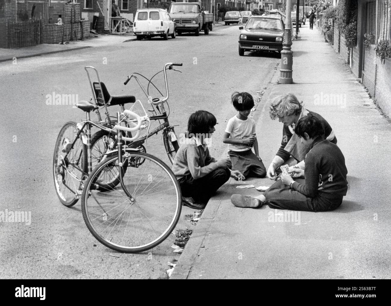 Boys playing cards on pavement in Whitmore Reans Wolverhampton England ...