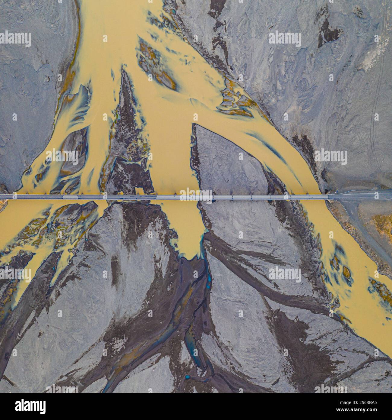 Aerial view of braided glacial rivers and a bridge in Hornafjörður ...