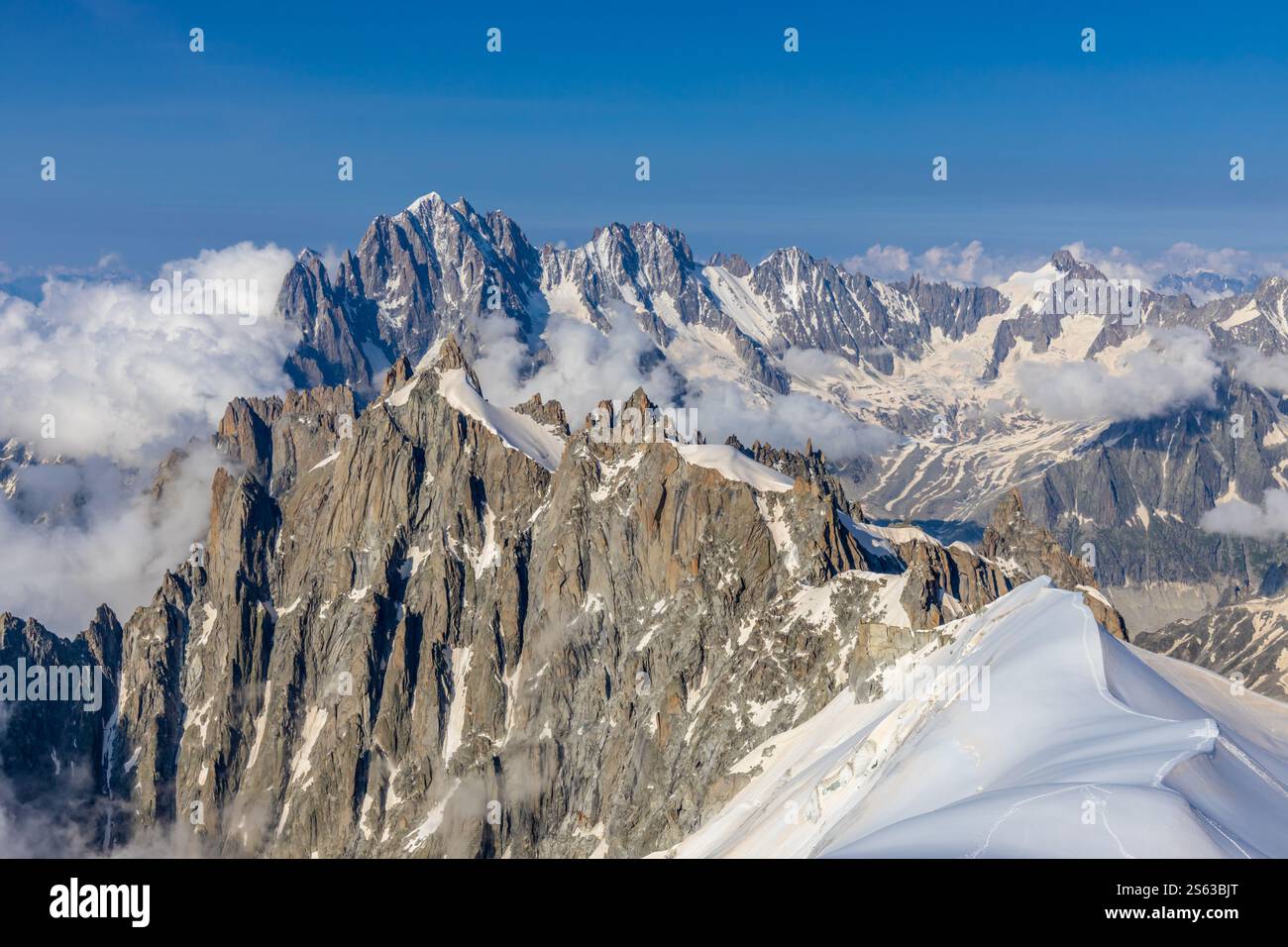 Snow mountain summits and white ice glacier in the Alps. Mont Blanc climbing route and views ...
