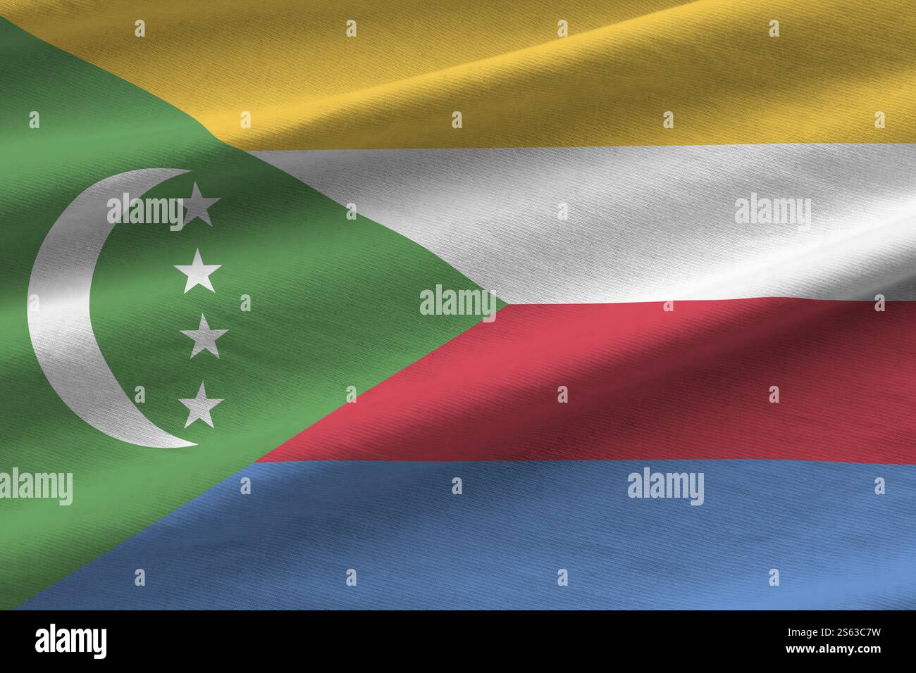 Comoros flag with big folds waving close up under the studio light ...
