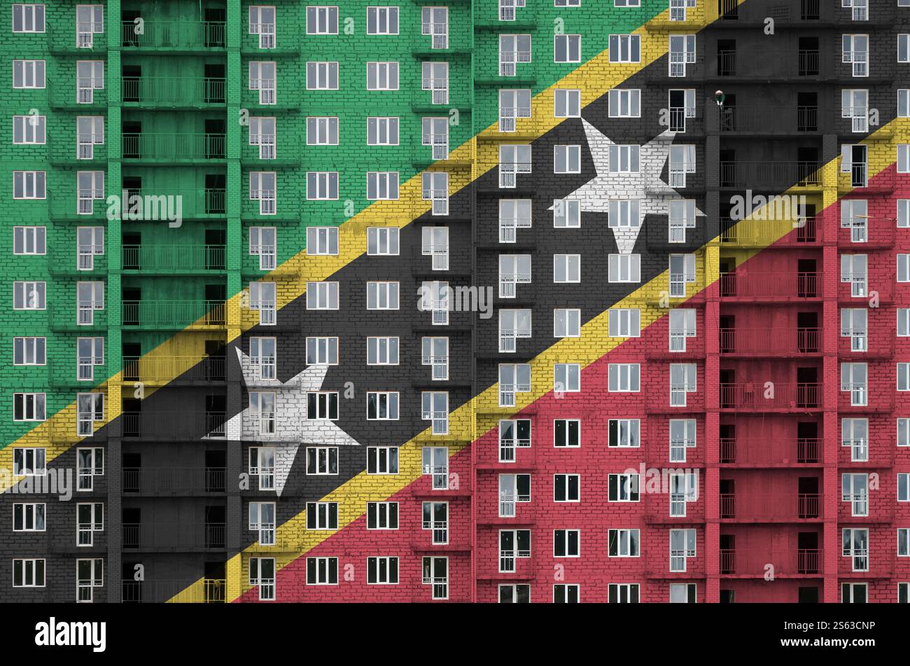 Saint Kitts and Nevis flag depicted in paint colors on multi-storey ...