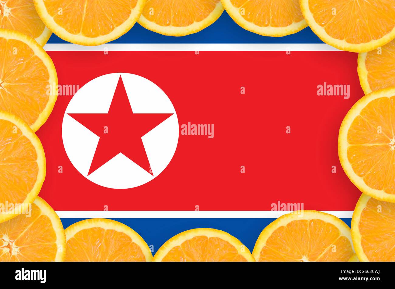 North Korea flag in frame of orange citrus fruit slices. Concept of ...