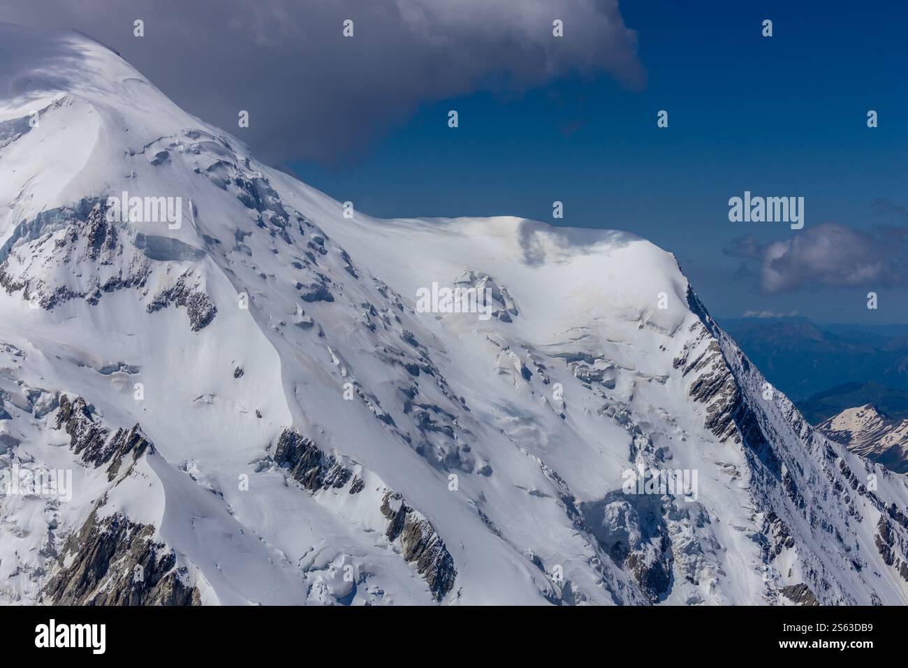 Snow mountain summits and white ice glacier in the Alps. Mont Blanc climbing route and views ...