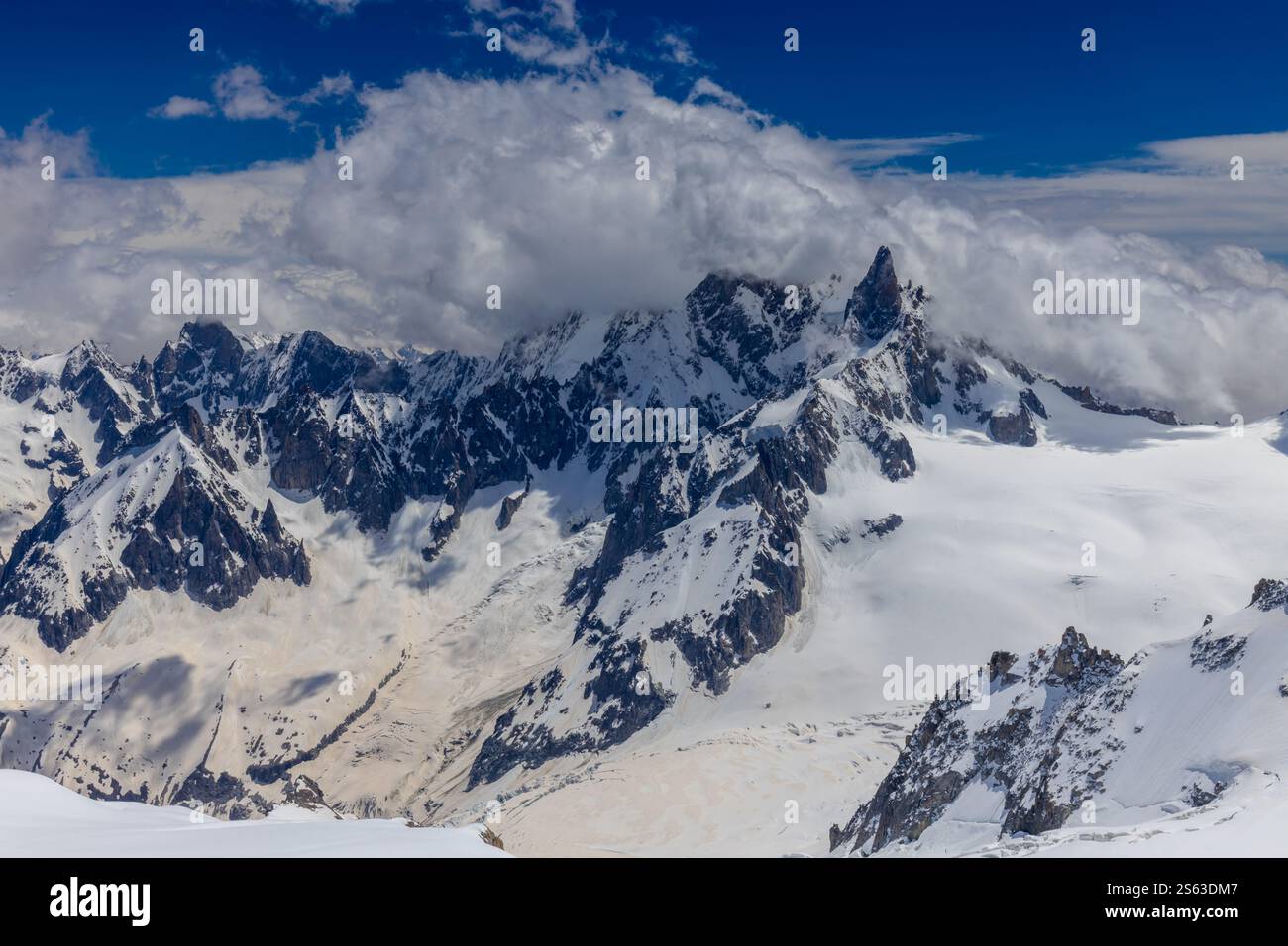 Snow mountain summits and white ice glacier in the Alps. Mont Blanc climbing route and views ...