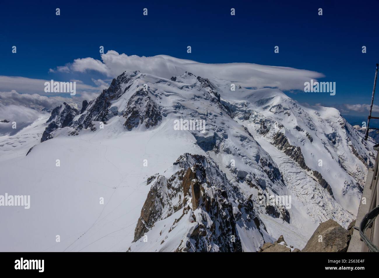 Snow mountain summits and white ice glacier in the Alps. Mont Blanc climbing route and views ...