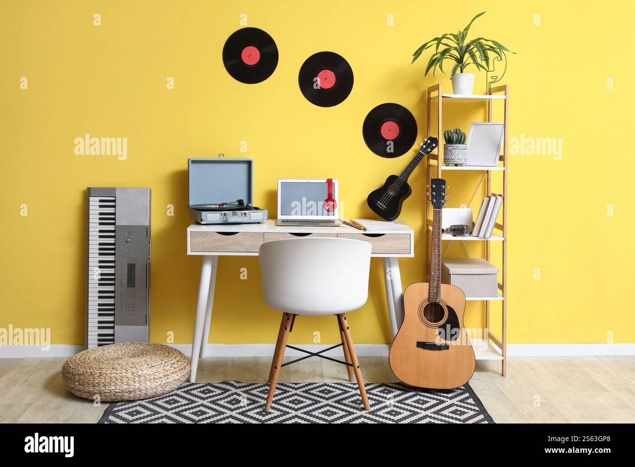 Interior of office with musician's workplace and shelf unit Stock Photo ...