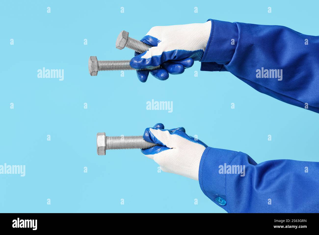 Mechanics hands holding bolts hi-res stock photography and images - Alamy