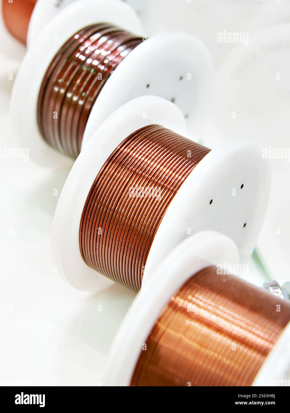 Winding enamelled copper wire on coils Stock Photo - Alamy