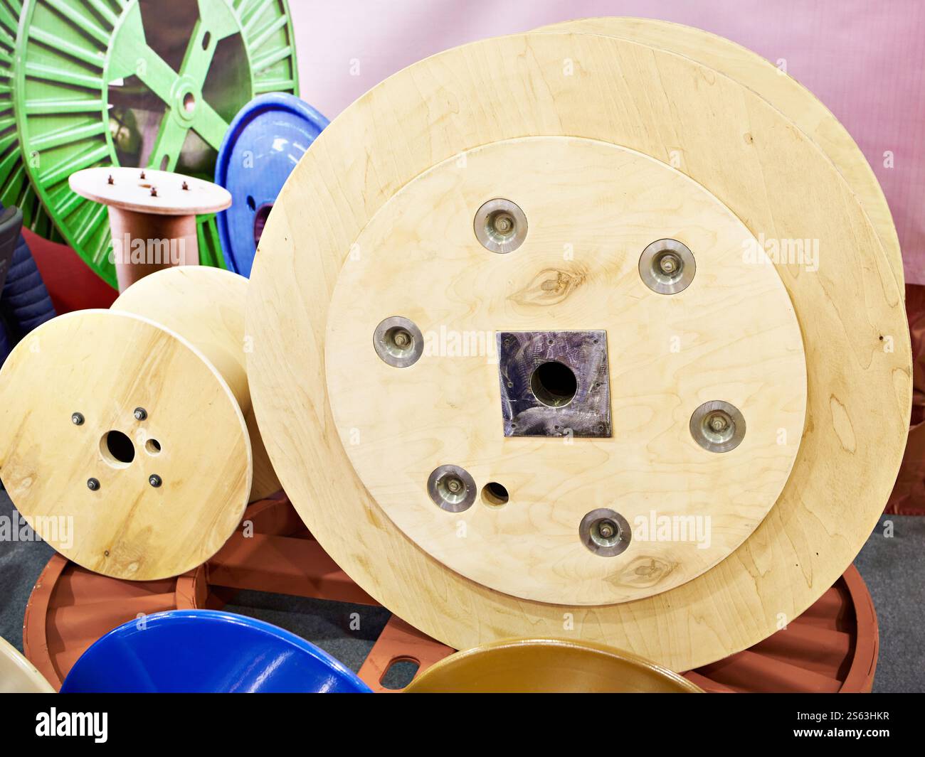 Plywood, metal cable drums, metal spools Stock Photo - Alamy