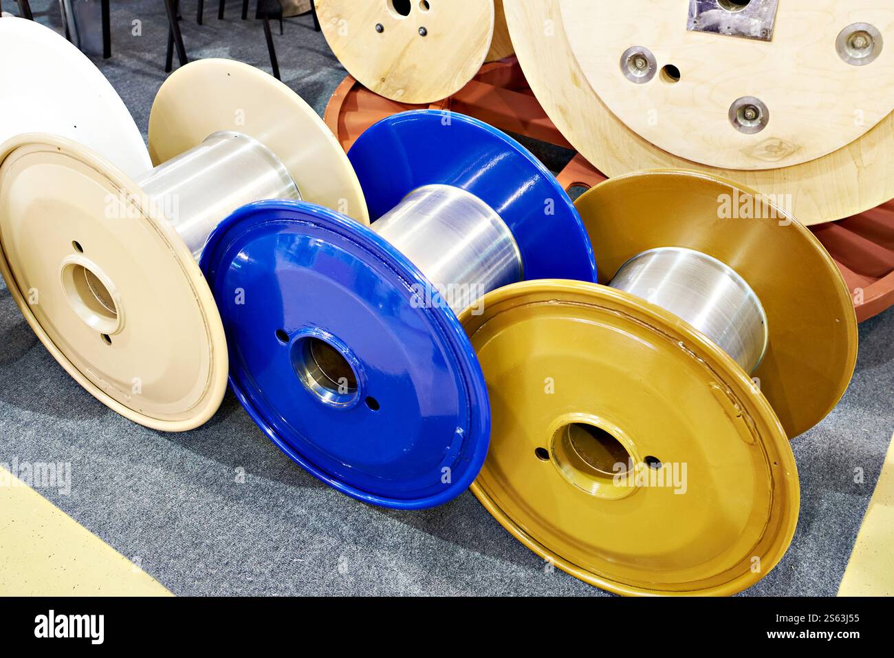 Plywood, metal cable drums, metal spools Stock Photo - Alamy