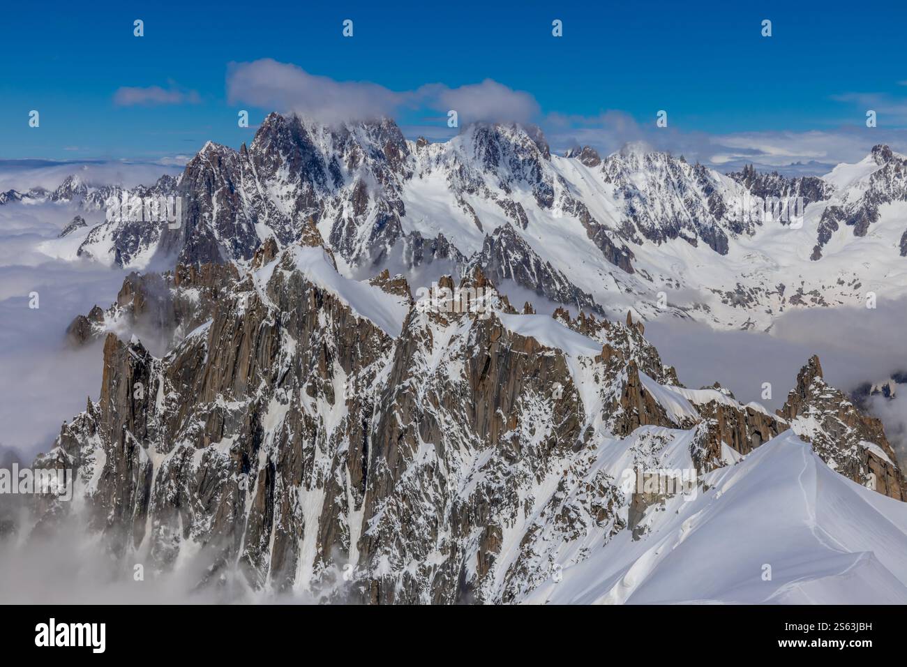 Snow mountain summits and white ice glacier in the Alps. Mont Blanc climbing route and views ...
