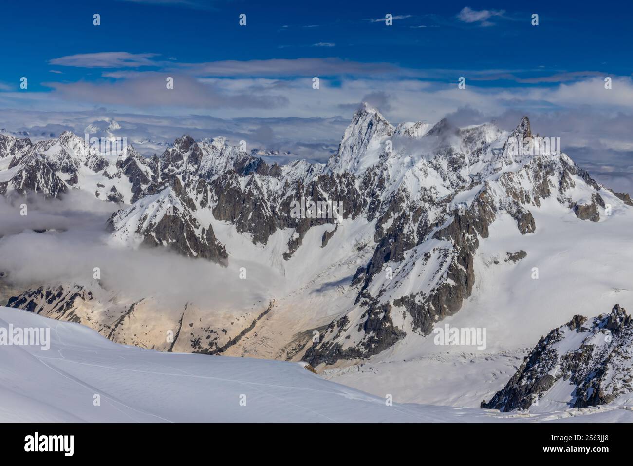 Snow mountain summits and white ice glacier in the Alps. Mont Blanc climbing route and views ...