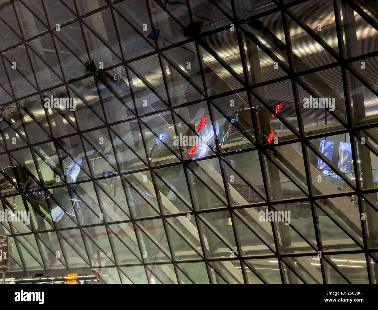 KRAKOW-BALICE, POLAND - OCTOBER 27, 2024: Taxi cars reflected in ...