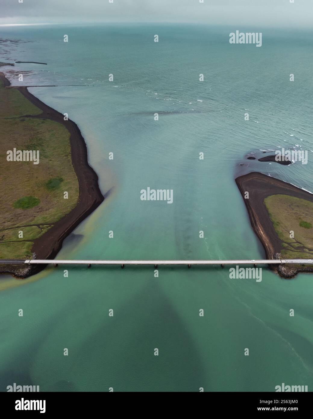 Aerial view of Olfusa River bridge in South Iceland with serene ...