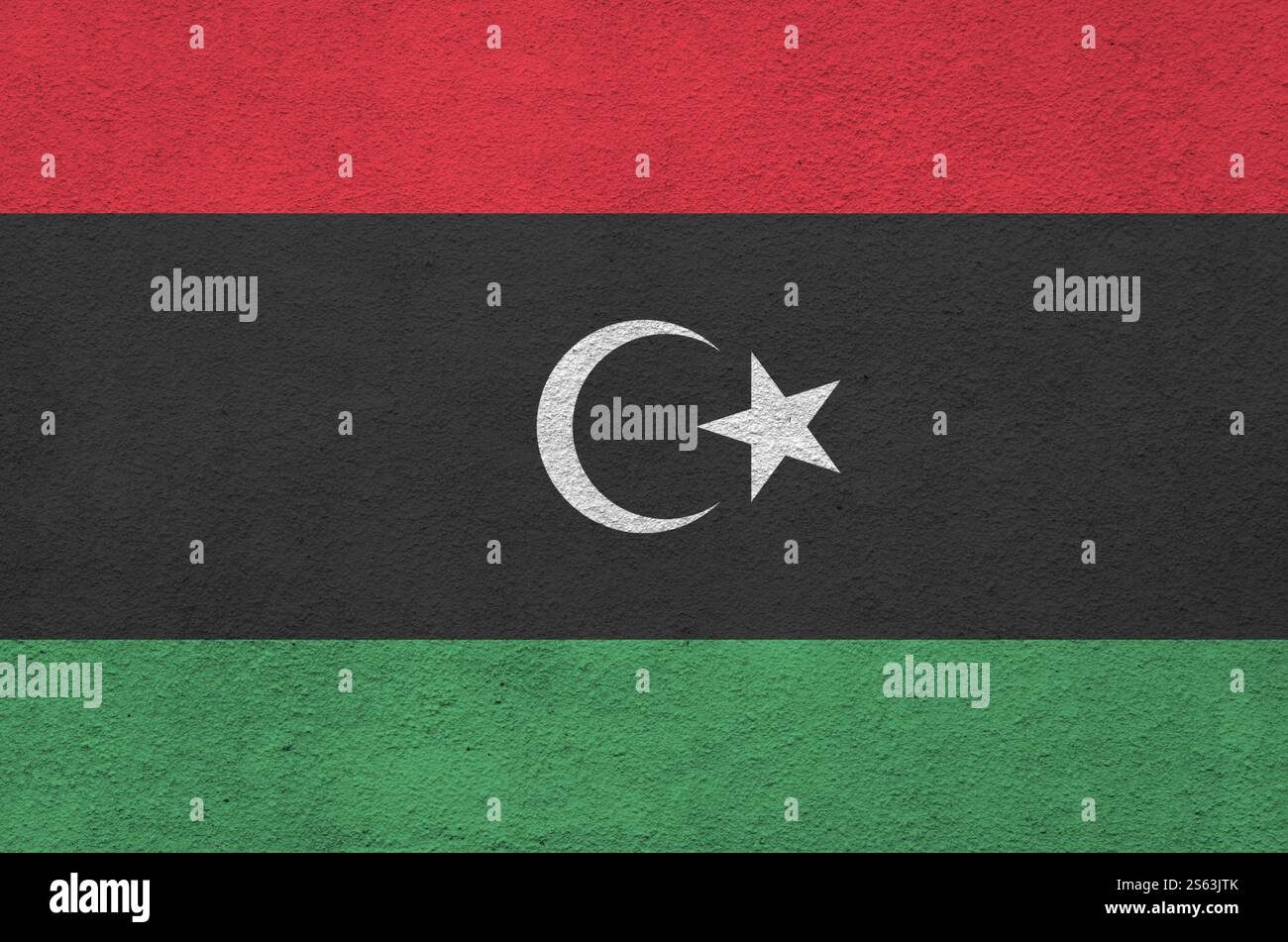 Libya flag depicted in bright paint colors on old relief plastering ...