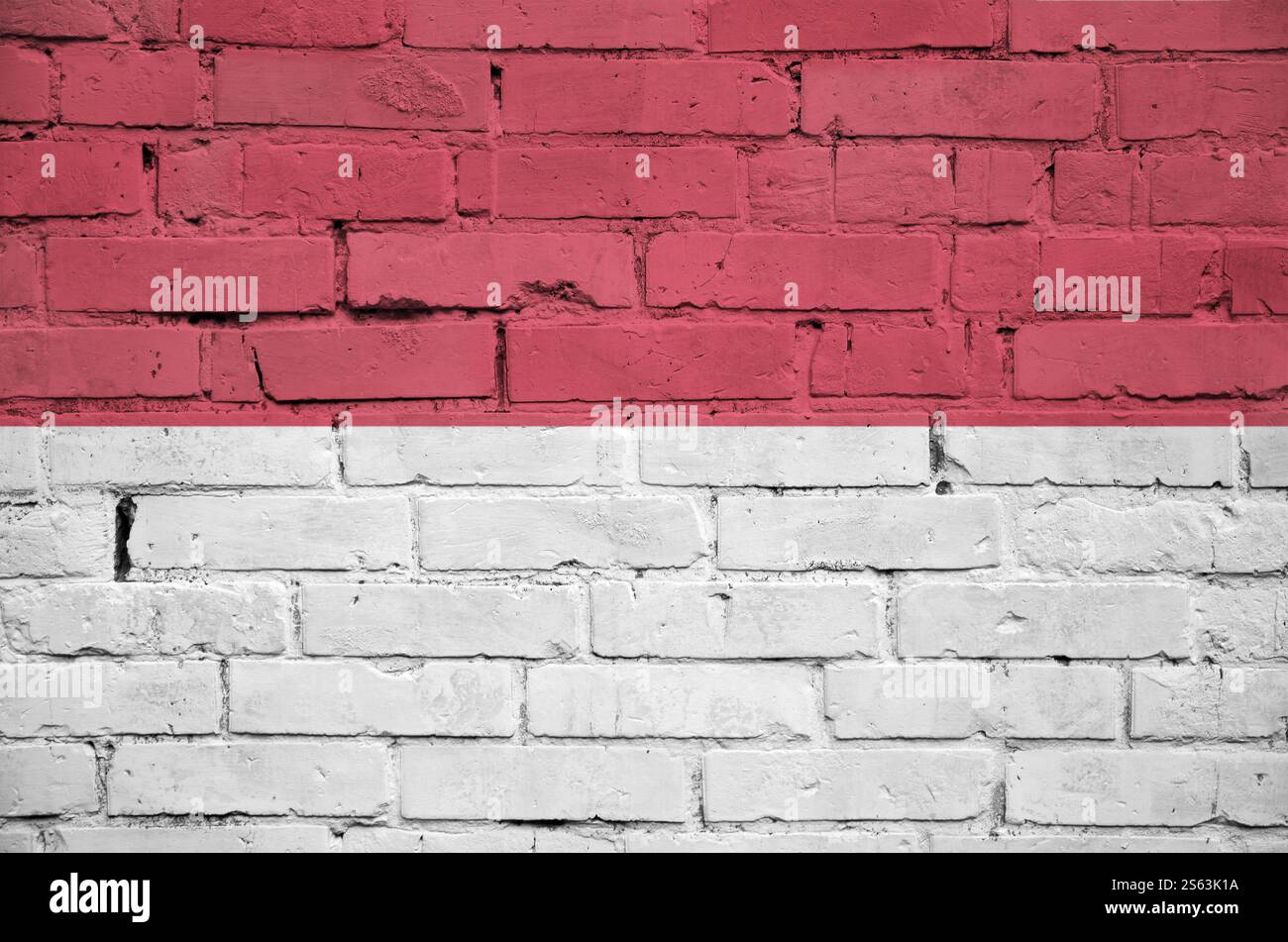 Monaco flag is painted onto an old brick wall Stock Photo - Alamy