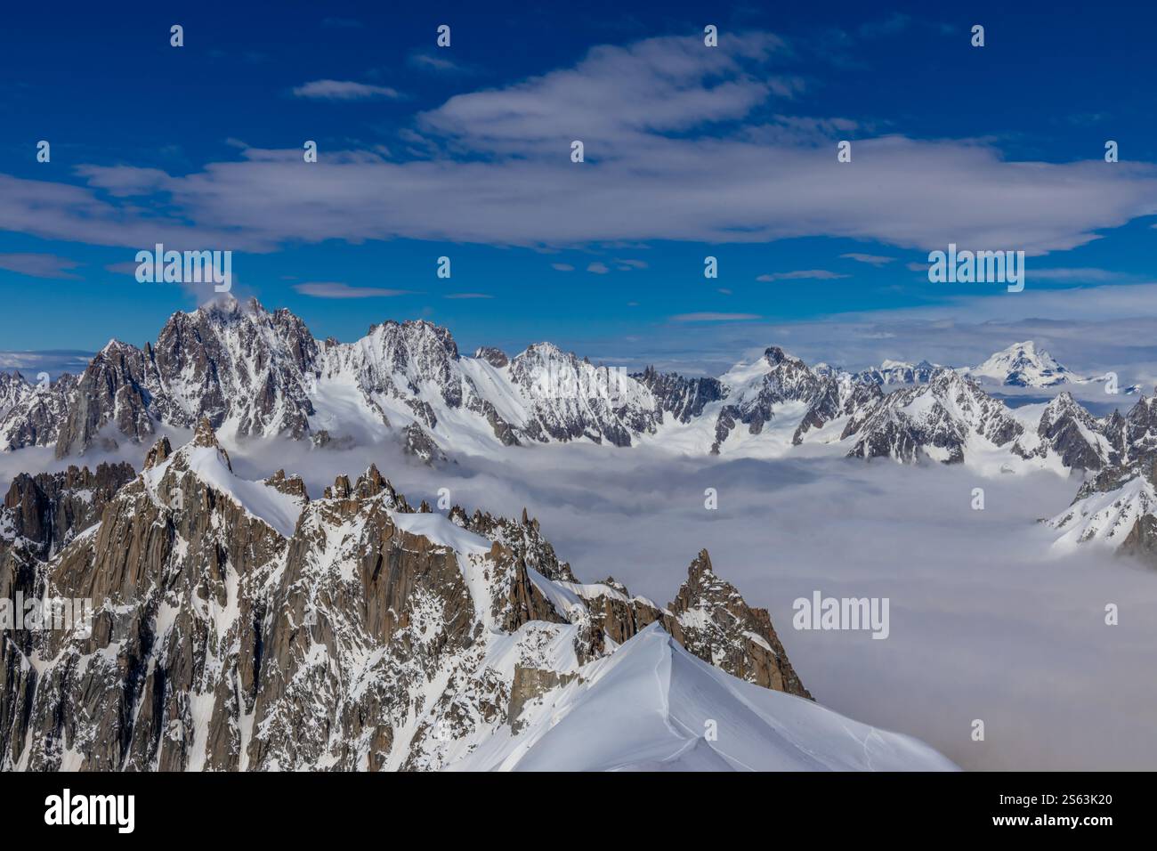 Snow mountain summits and white ice glacier in the Alps. Mont Blanc climbing route and views ...